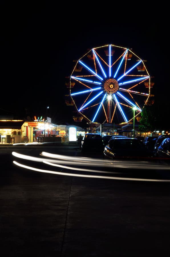 Ferris wheels at night stock photo. Image of pods, funfair - 65771908