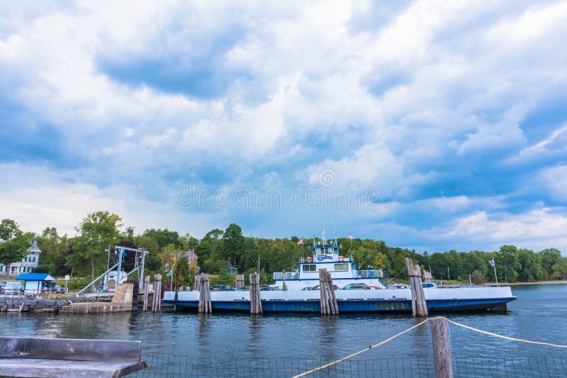 Ferry docking at pier stock photo. Image of cars, water - 61481340