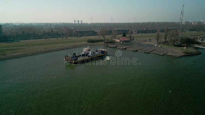 Ferry in Scheur River, Going Towards the Dock, with Leafless Trees in ...