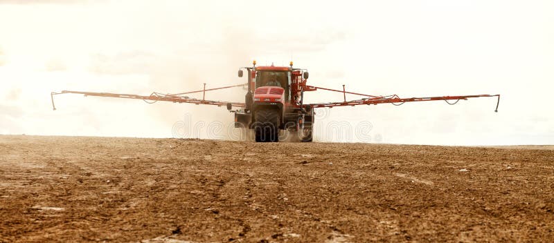 A Long Arm Agricultural Fertilizer Spreader Stock Photo - Image of soil ...
