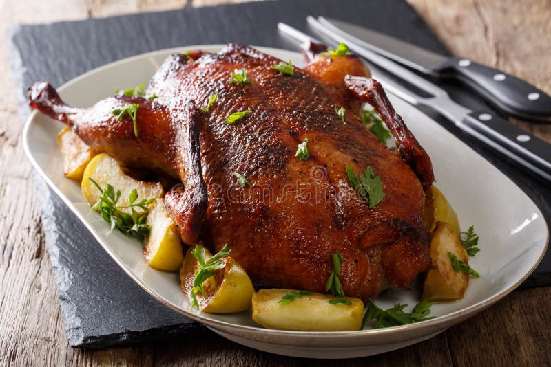 Festive Baked Duck with Apples Close-up on a Table. Horizontal Stock ...