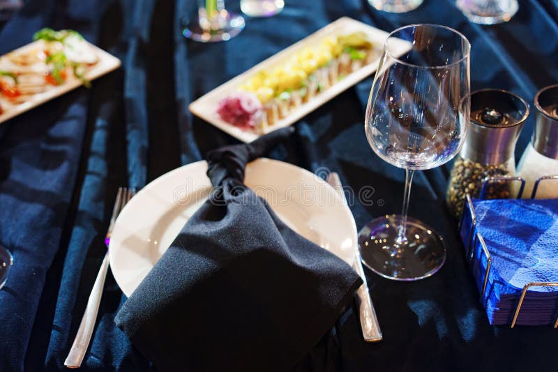 Festive Banquet Table Setting with Classic White Dishes and Dark ...
