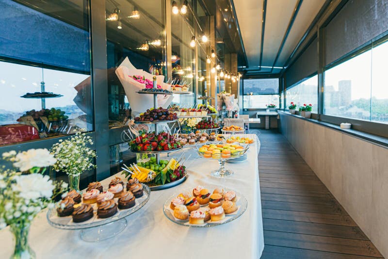 Festive Buffet Table with Delicious Desserts of Different Colors at the ...