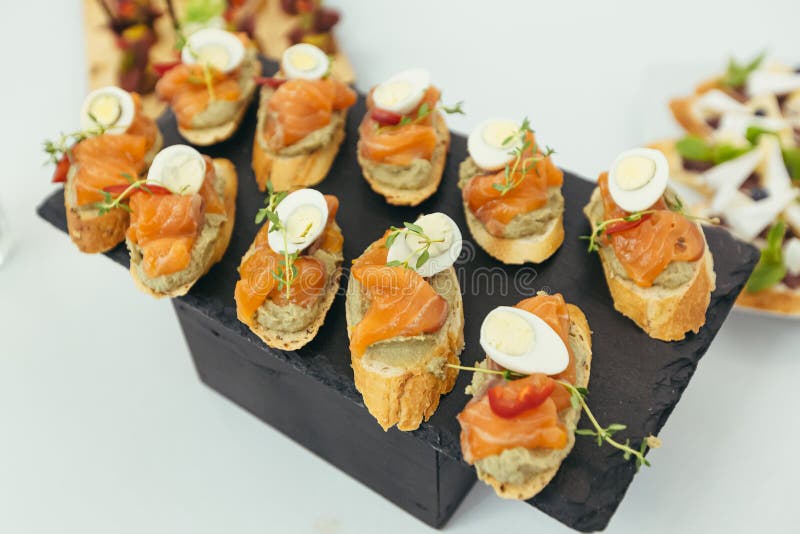 Festive Buffet Table with Various Snacks of Fish and Meat Stock Photo ...