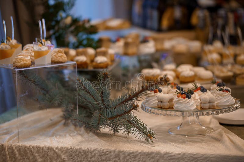 Festive Dessert Table with Delicacies and Decorative Greenery Stock ...