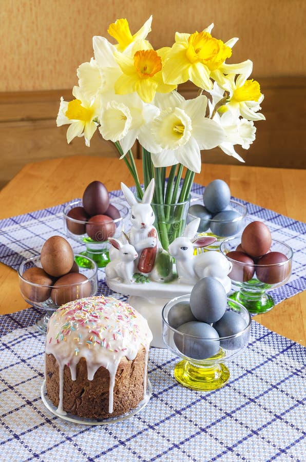 Festive Easter Table Decorated with Flowers, Colored Eggs and Cakes ...