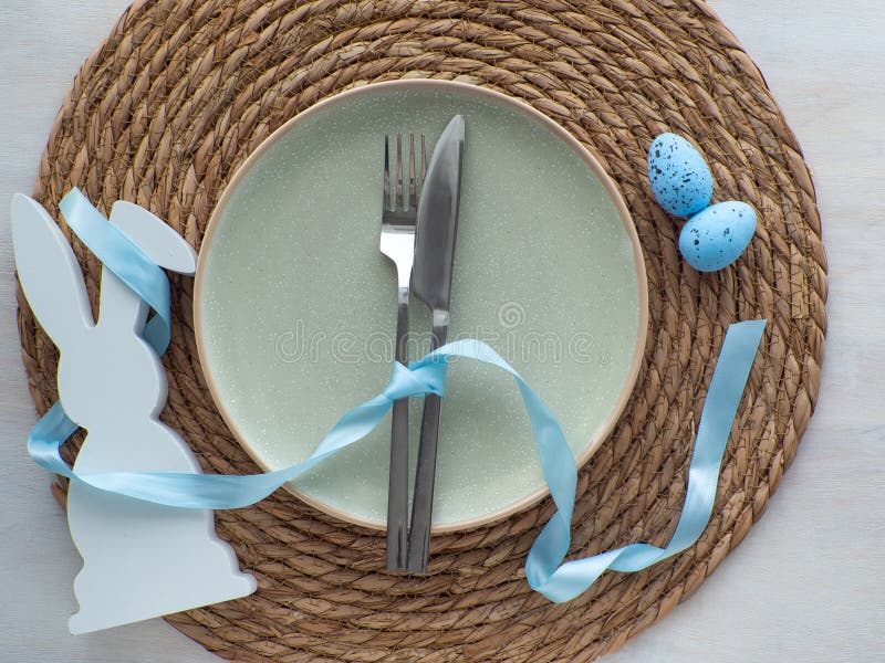 Festive Easter Table Setting with Eggs and Bunny on Brown Background ...