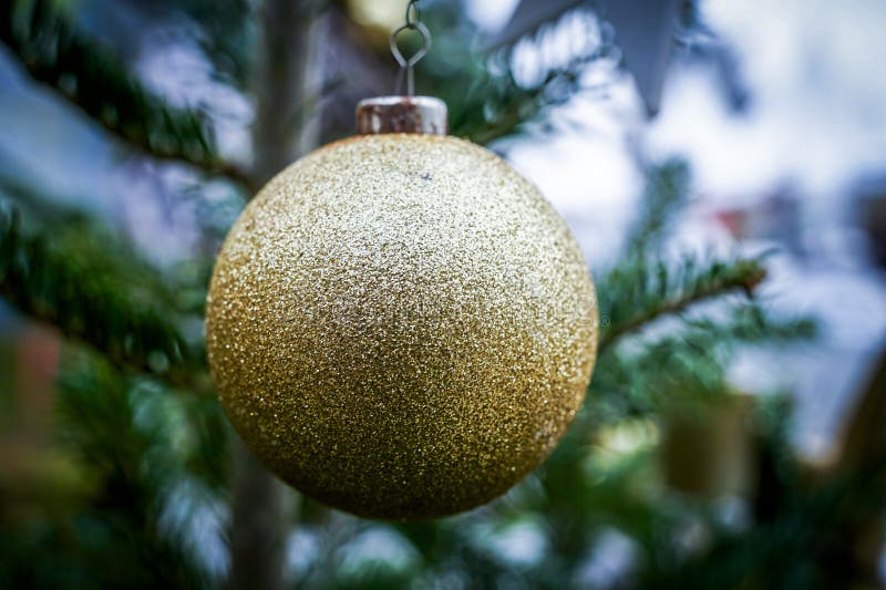 Festive Golden Christmas Bauble on a Decorated Christmas Tree Stock ...