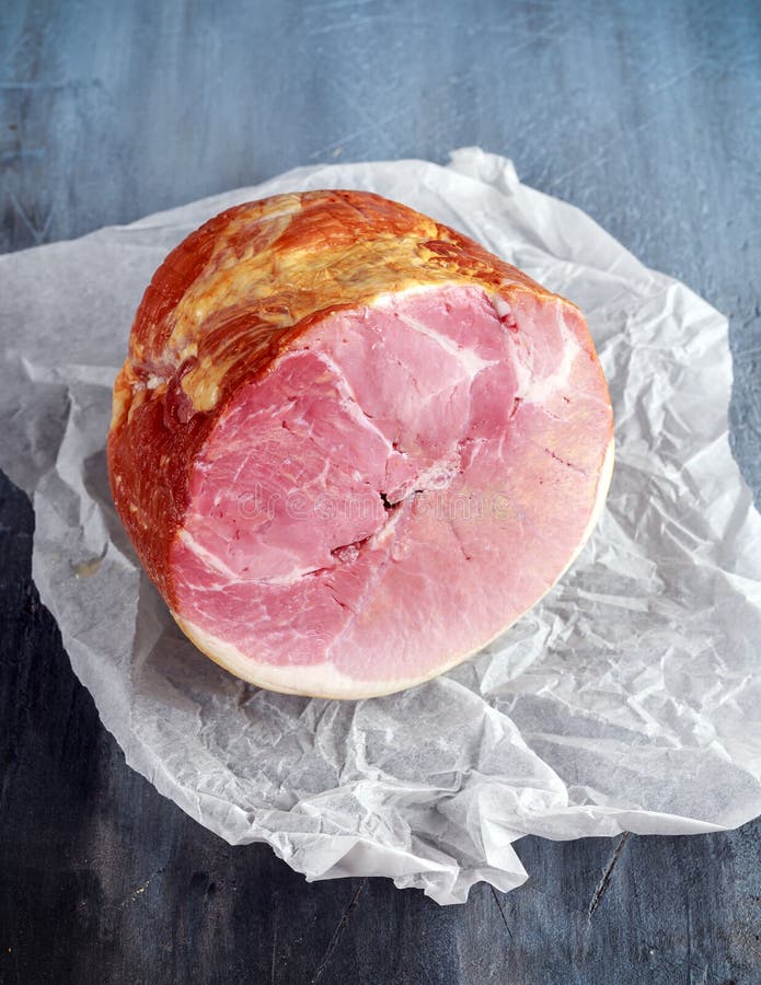 Festive Ham Sliced on Crumpled Rustic Paper Stock Image - Image of ...