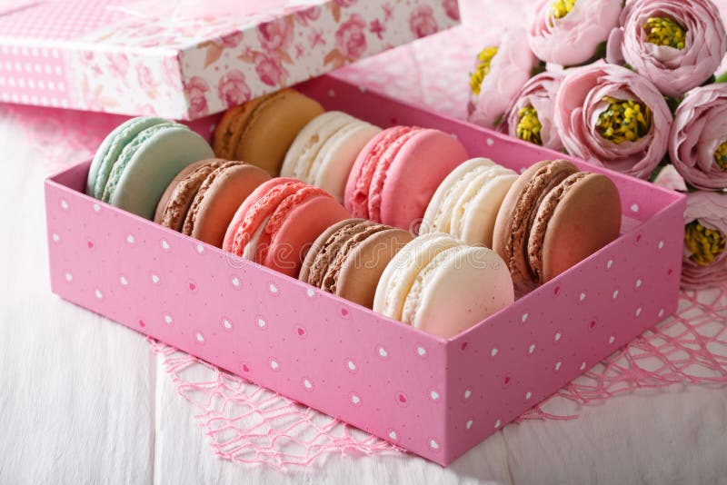Festive Macaroons in a Gift Box and Flowers Close-up. Horizontal Stock ...