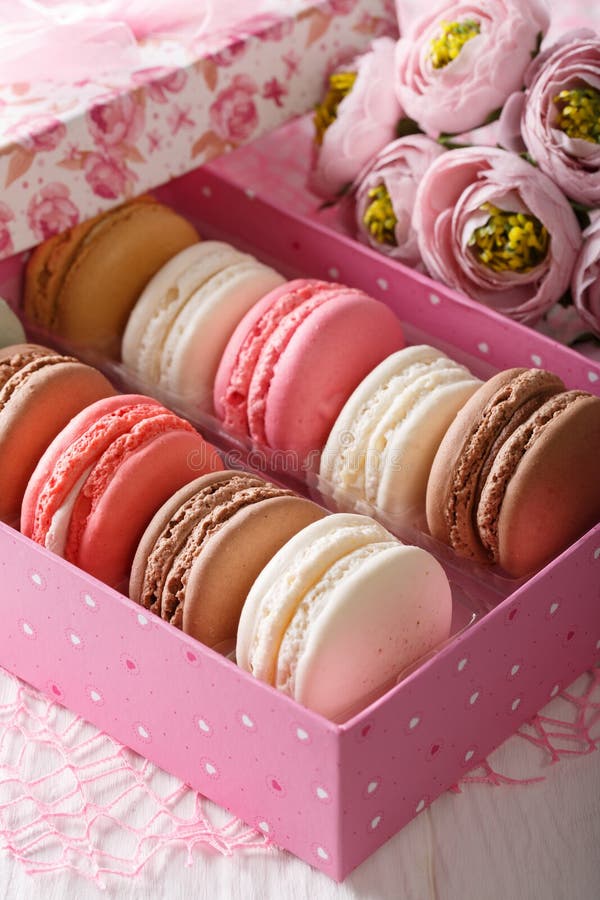 Festive Macaroons in a Gift Box and Flowers Close-up. Vertical Stock ...