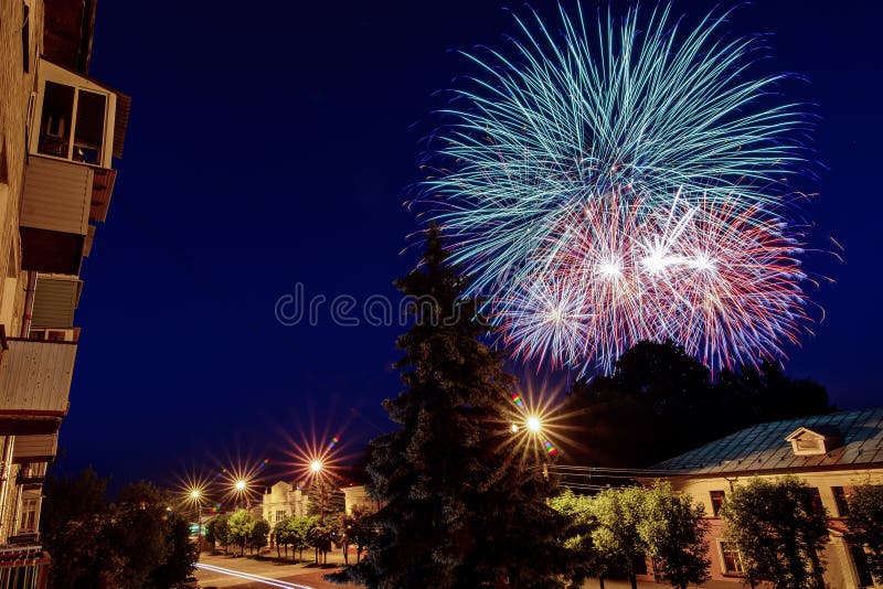 Festive Multicolored Fireworks Over City at Night Stock Image - Image ...