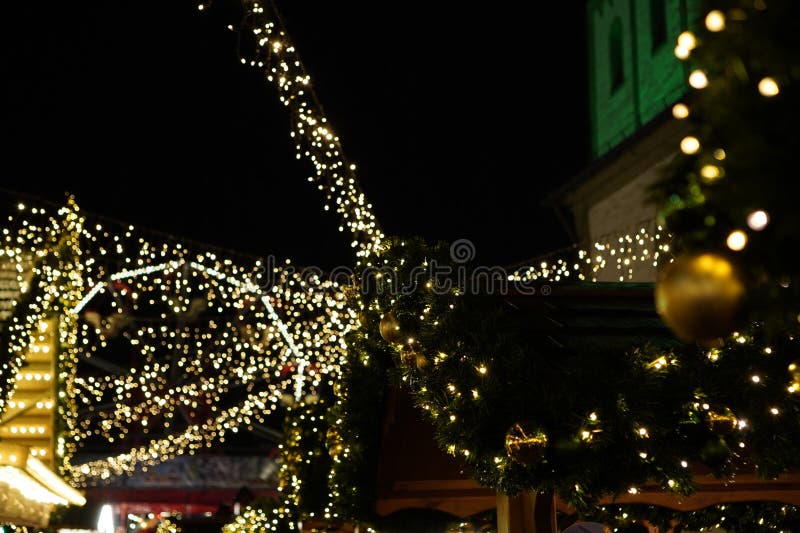 A Festive Scene with Many Lights and Decorations, Including a Christmas ...
