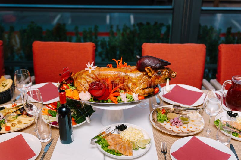 Festive Set Table in a Restaurant with Appetizers and a Roasted Pig on ...