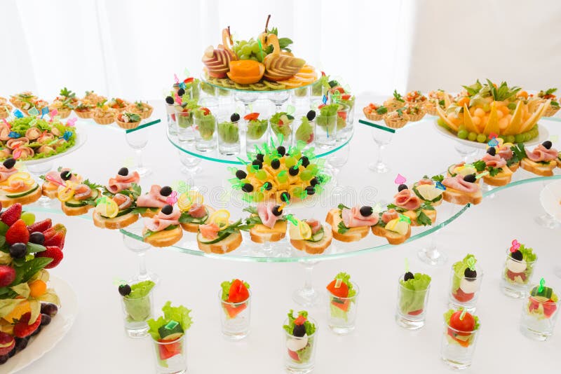 Light Snacks in a Plate on a Buffet Table. Assorted Mini Canapes ...