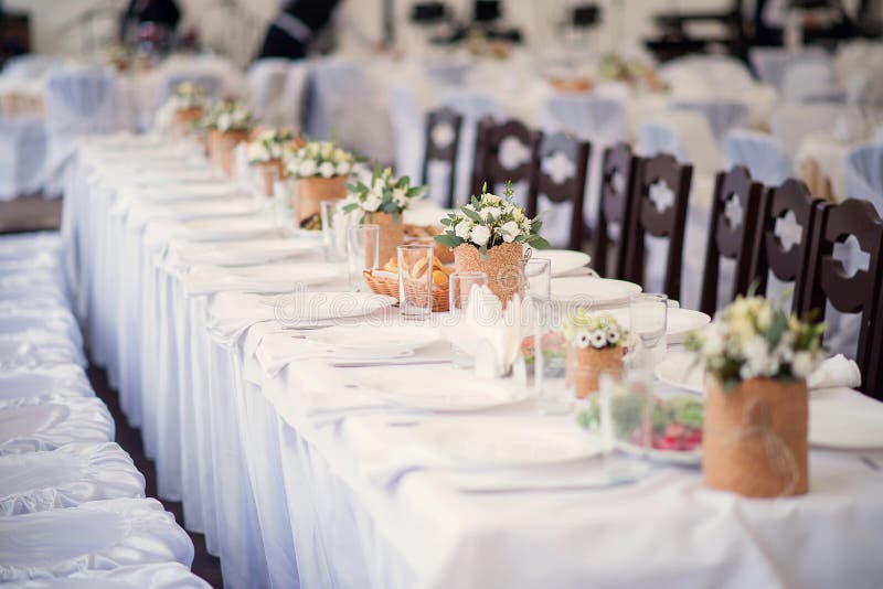 The Festive Table Setting is Decorated with Flowers of Roses in a ...