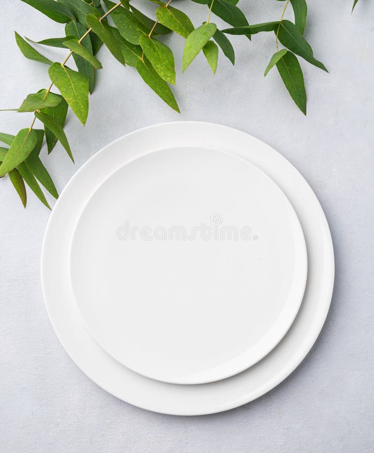 Festive Table Setting with White Plates on a Light Background with ...