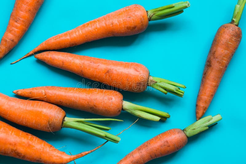 A Few Fresh Carrots on Blue Background Stock Image - Image of healthy ...