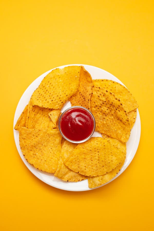 Few Mexican Nachos Chips in Small Plate with Sauce Stock Photo - Image ...
