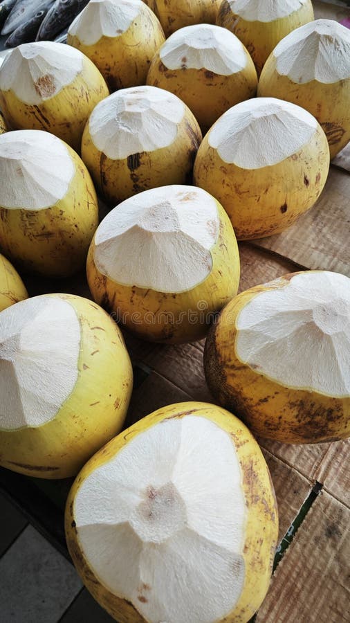 A Few Partially Husked Coconut on Display. Stock Photo - Image of green ...