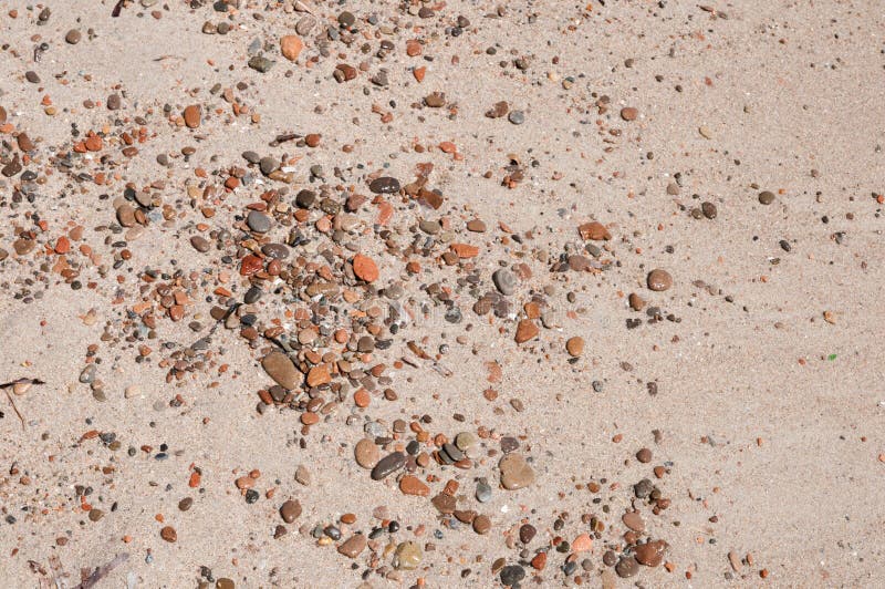 Few pebbles in sand stock image. Image of beauty, pebble - 43881789