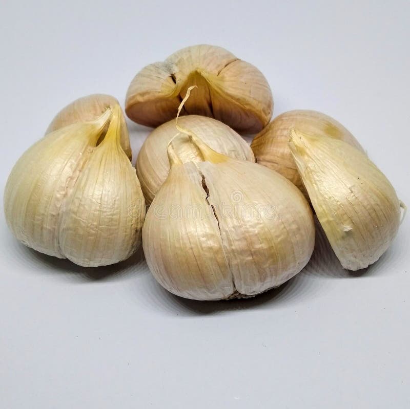 A Few Pieces of Raw Garlic on a White Background Stock Photo - Image of ...