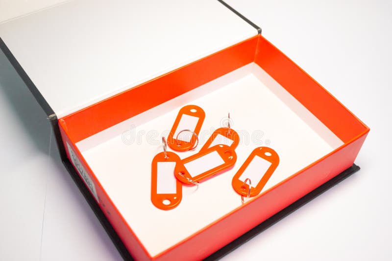 A Few Red Plastic Labels for Numbering the Keys in a Box with Red Edges ...