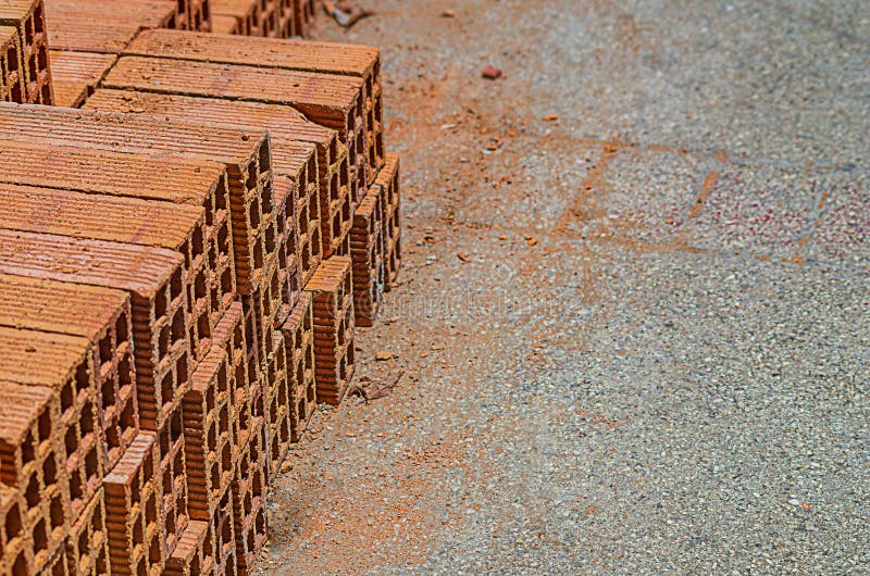 A Few Remaining Rows of Red Mud Bricks Unloaded at the Sidewalk and ...