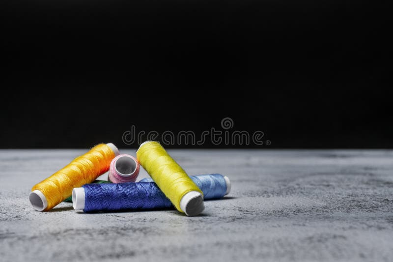 Red Unused Thread Spool on a Full Black Background Stock Photo - Image ...