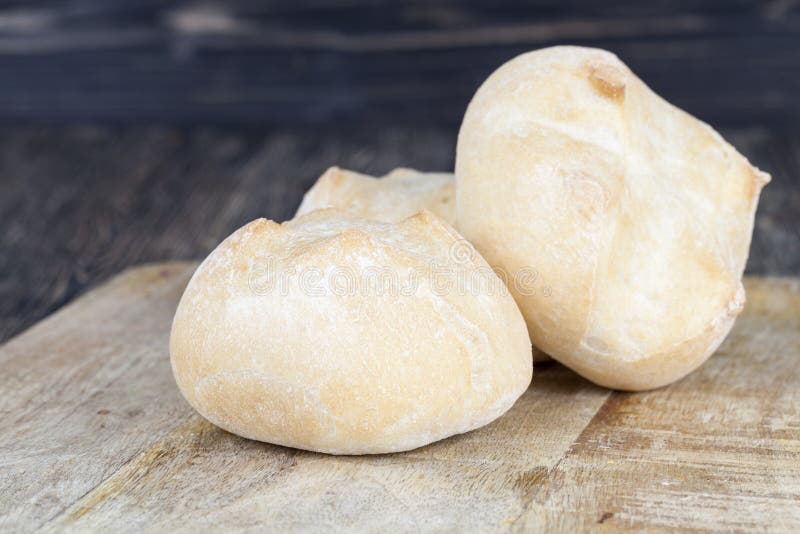 A few wheat light buns stock image. Image of bread, board - 144268441