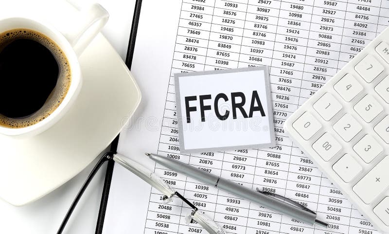 FFCRA Text on Sticky on Chart with Coffee,pen and Calculator Stock ...