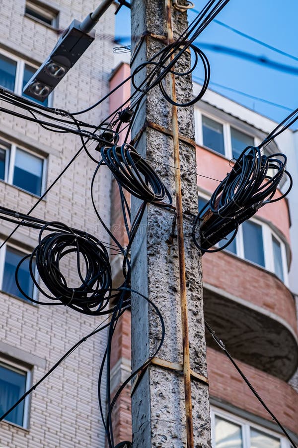 A Fiber Optic Cable Harness for Communication Weighs on a Concrete ...