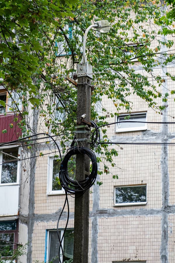 A Fiber Optic Cable Harness for Communication Weighs on a Concrete ...