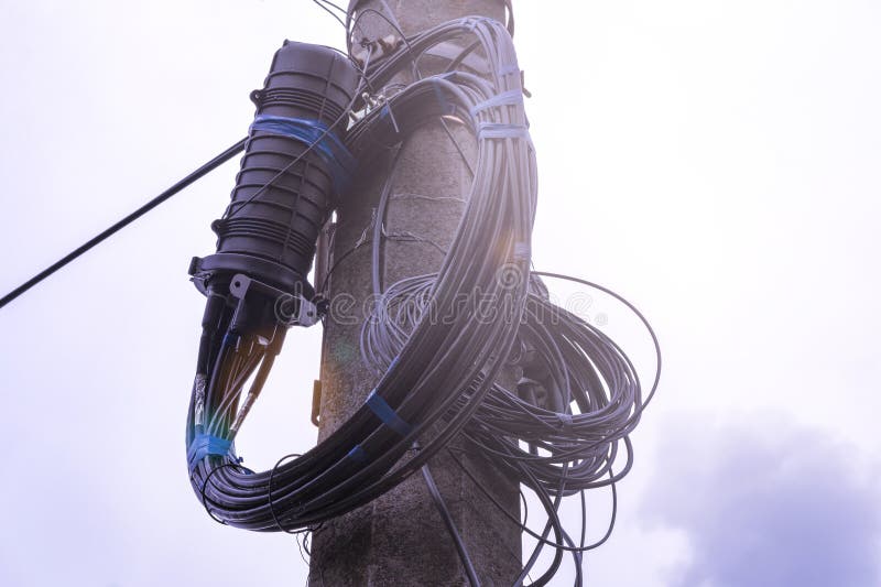 A Fiber Optic Cable Harness for Communication Weighs on a Concrete ...