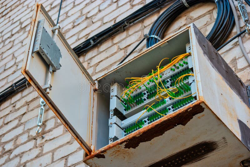 Fiber Optic Switch Panel on Apartment Building Wall with Coil of Wires ...