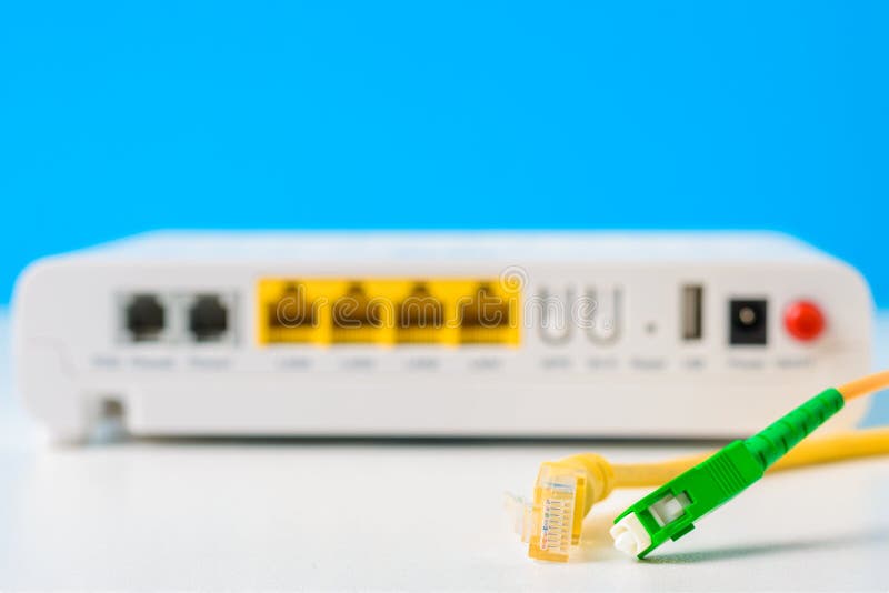 Fiber Optical and Network Cables with Internet Wireless Router on a ...
