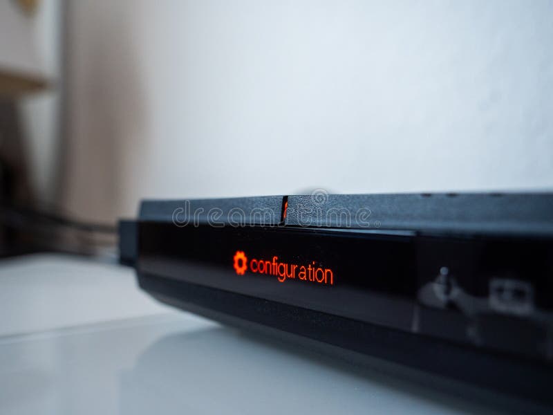 Fiber Set-top Box on Table with Configuration Message Illuminated ...