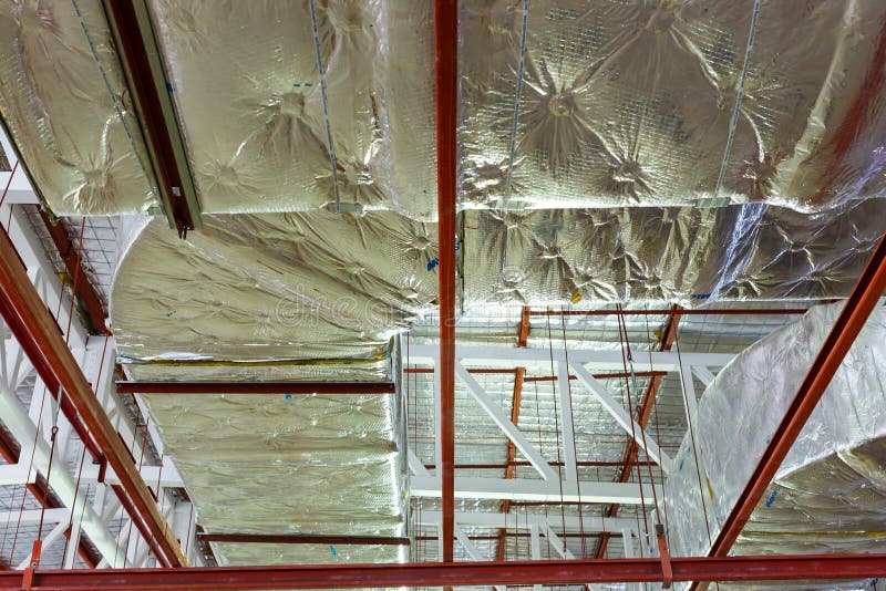 High-rise Building Under Construction with a Waterproofing and Warming ...