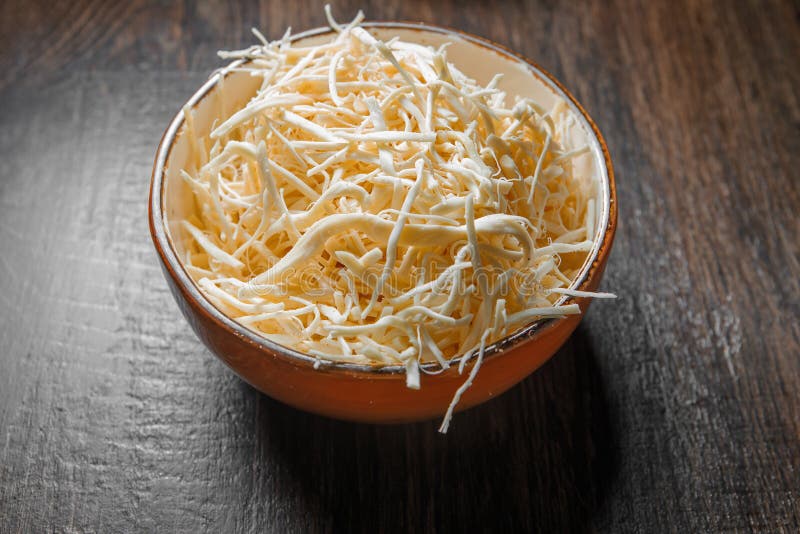 Fibrous Chechil Cheese in a Deep Cup Stands on a Wooden Table Stock ...