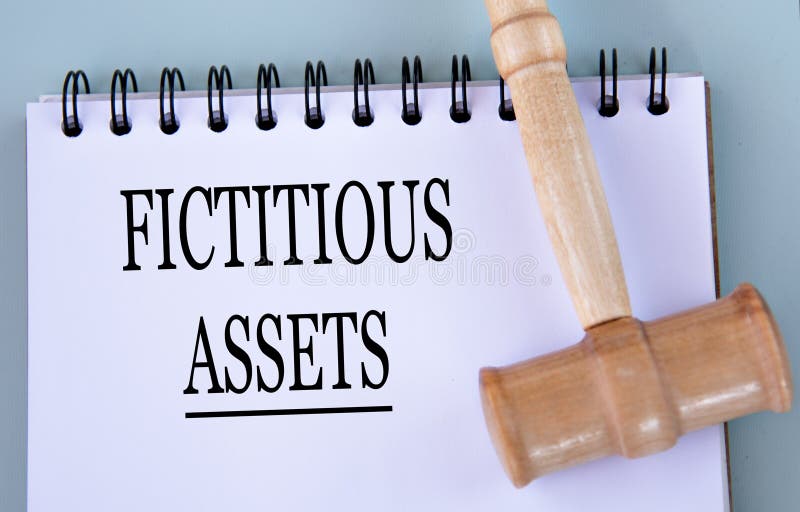FICTITIOUS ASSETS - Words in a Notebook on a Gray Background with a ...