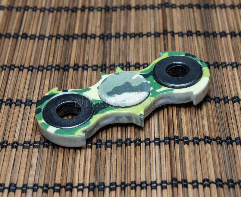 Fidget Spinner on Bamboo Mat Stock Photo - Image of stress, roller ...