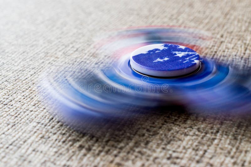 Fidget Spinner on a Grey Surface. Stock Photo - Image of figet, energy ...