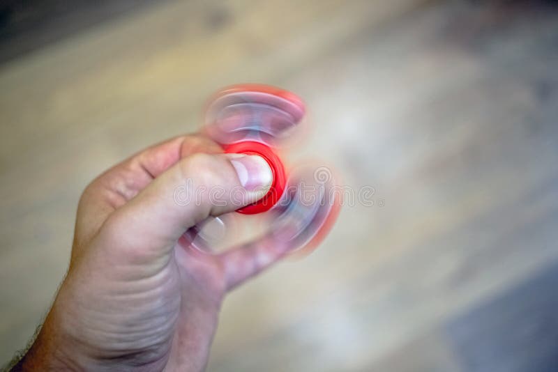 Fidget Spinner in the Man Hand. Stock Image - Image of holding ...