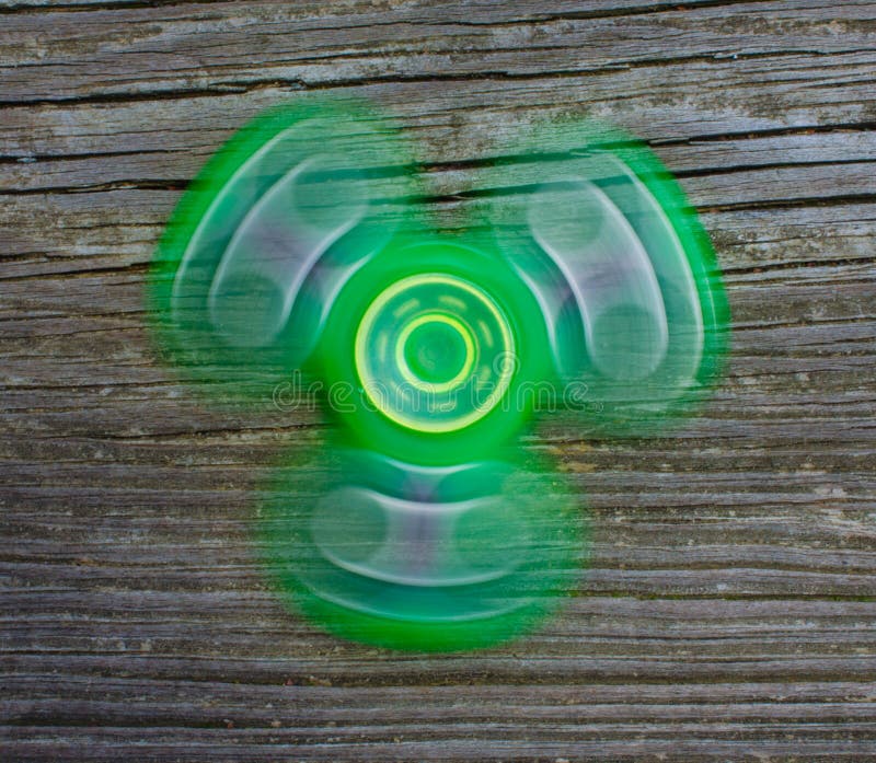 Fidget spinner in motion. stock photo. Image of spinner - 93126360