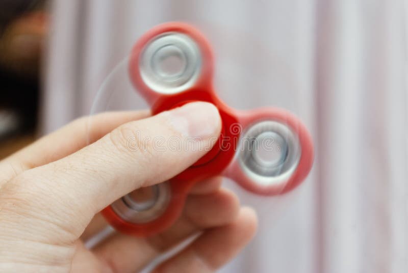 Fidget Spinner Rotating in the Hand. Stock Photo - Image of energy ...