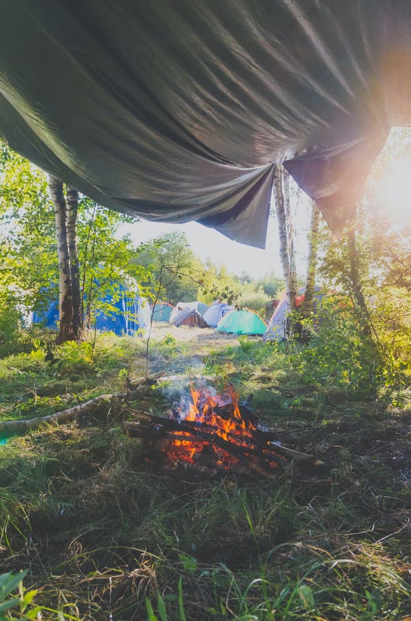On the Field is a Camp and Lit a Fire Under the Awning Stock Image ...
