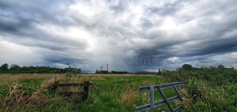 Field of dramatic clouds stock image. Image of field - 218099349