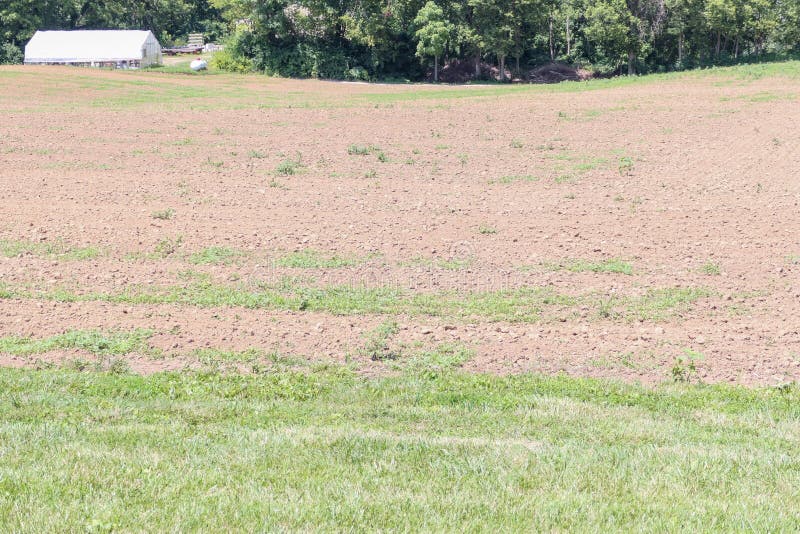 A fallow field on a farm stock image. Image of looks - 193030151