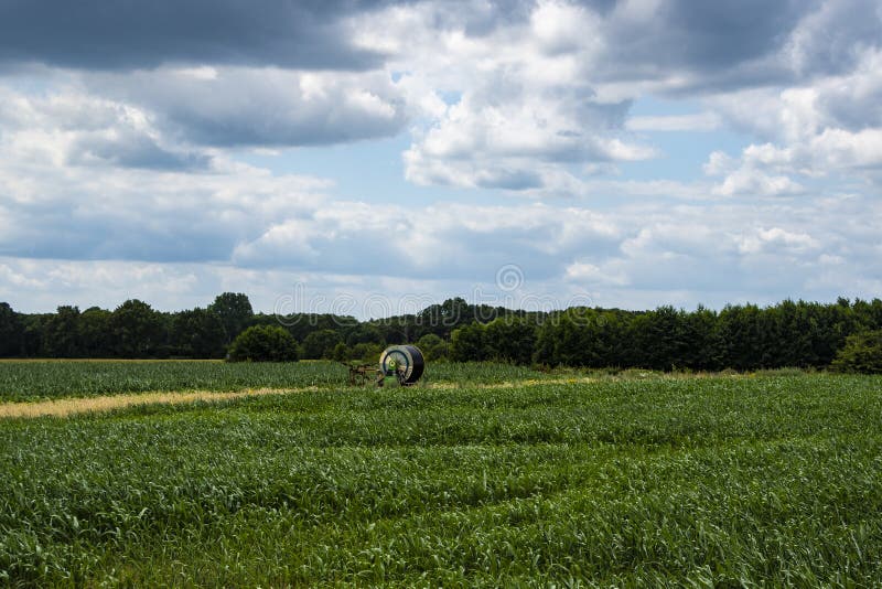 Field Irrigation System with Water Sprinklers Working on Farm Field ...