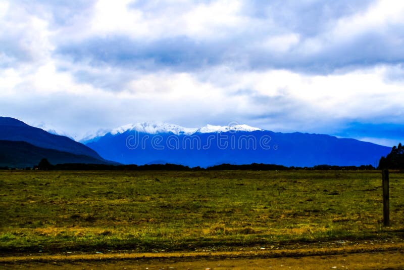 Field with Mountains in the Background Stock Photo - Image of hill ...